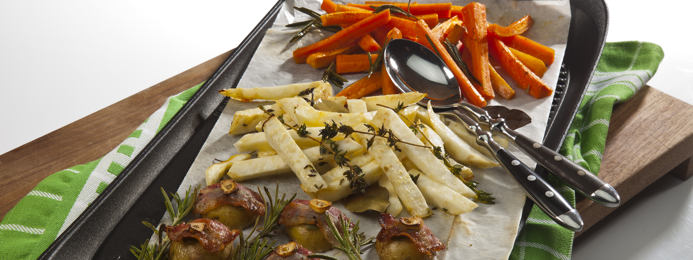 Baked vegetable sticks and roast potatoes with bacon